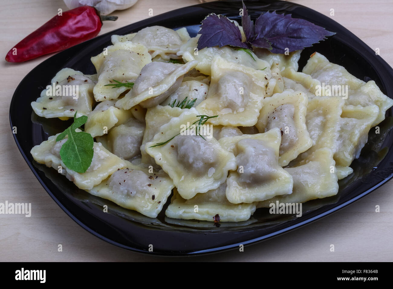 Italian dumplings Ravioli with fresh herbs and spices Stock Photo - Alamy