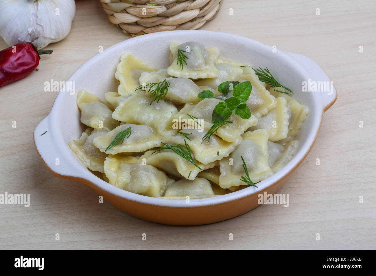Italian dumplings Ravioli with fresh herbs and spices Stock Photo - Alamy