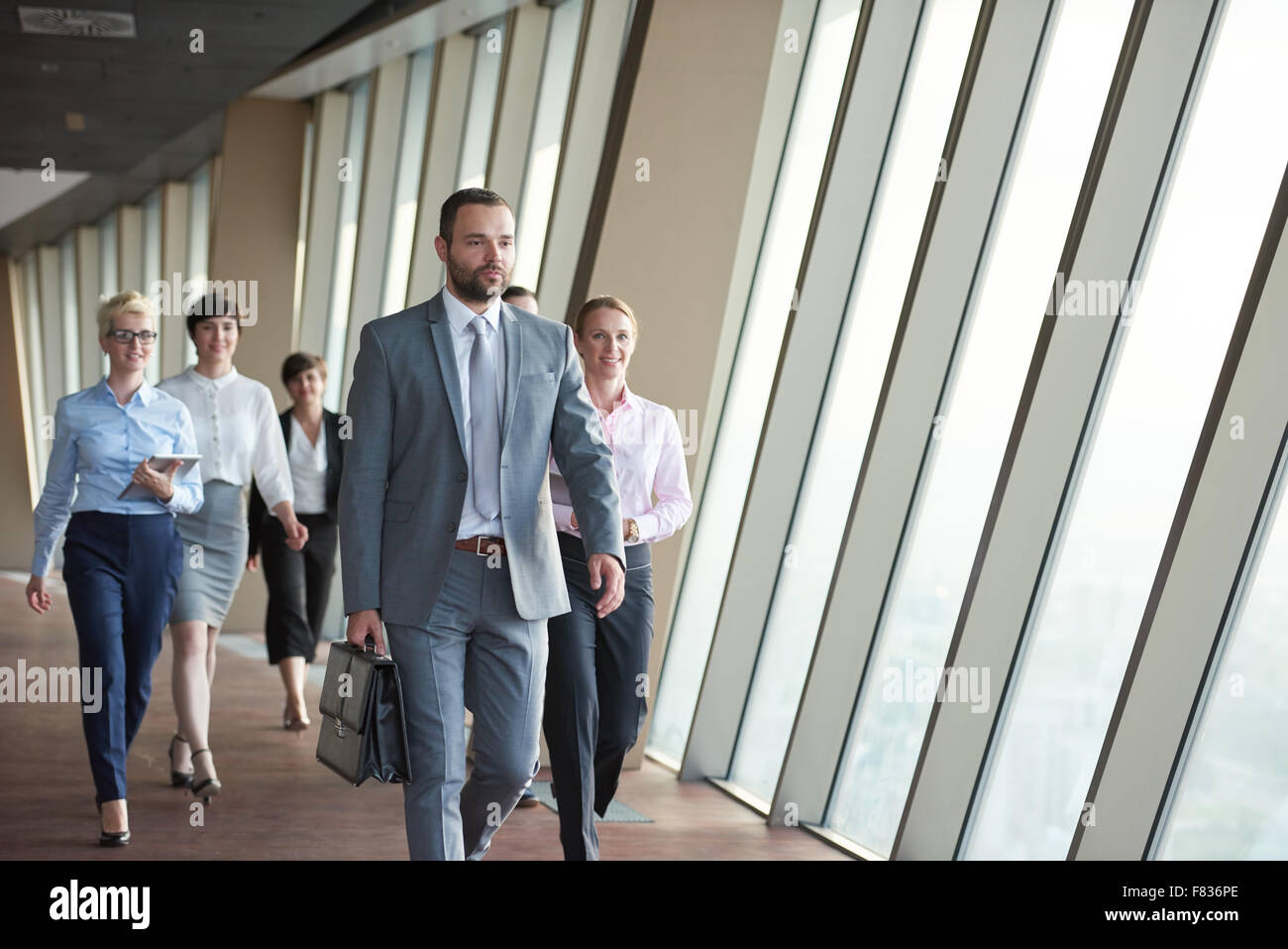 business team, businesspeople group walking at modern bright office ...