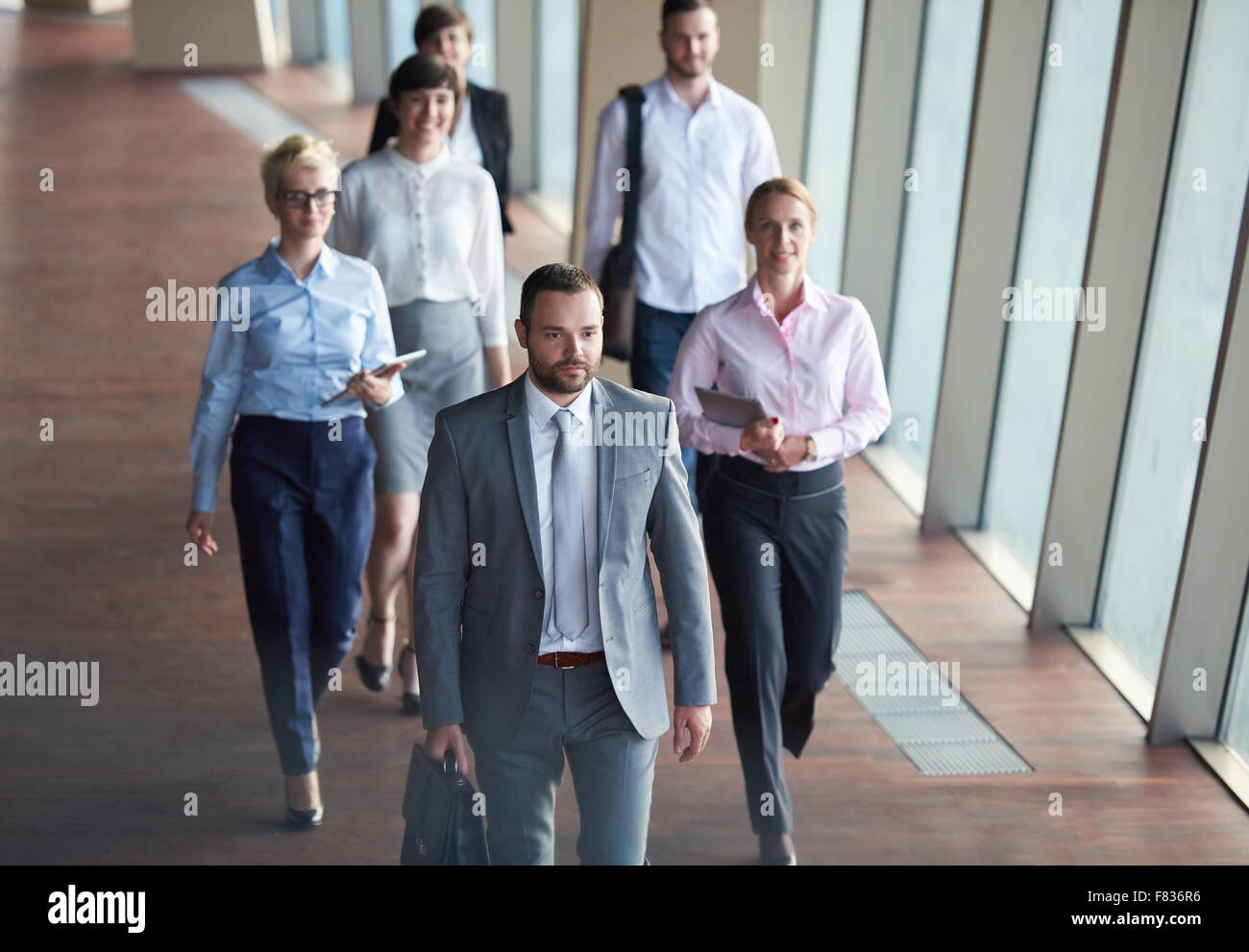 business team, businesspeople group walking at modern bright office ...