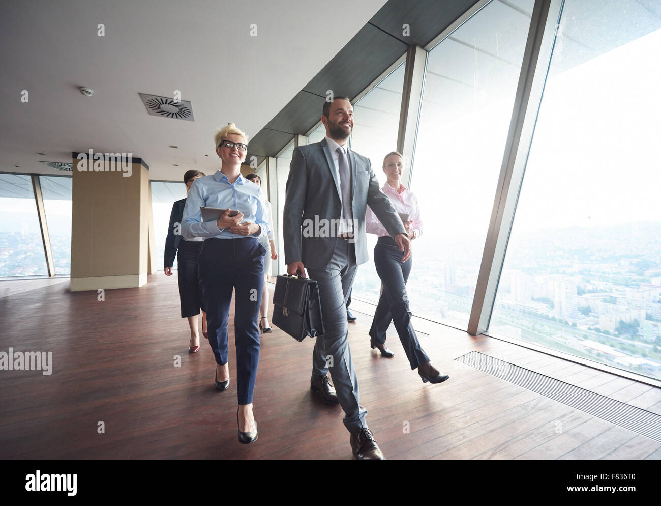 business team, businesspeople group walking at modern bright office ...