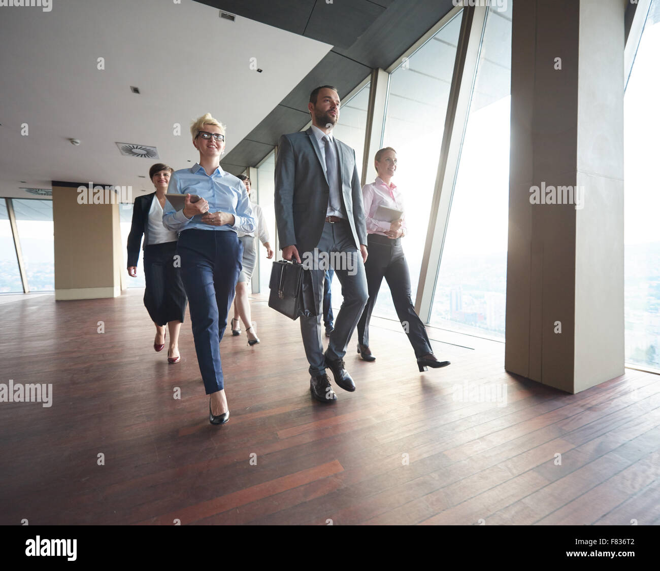 business team, businesspeople group walking at modern bright office ...