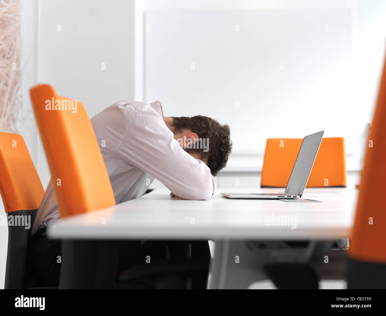 Frustrated man sitting on hi-res stock photography and images - Alamy
