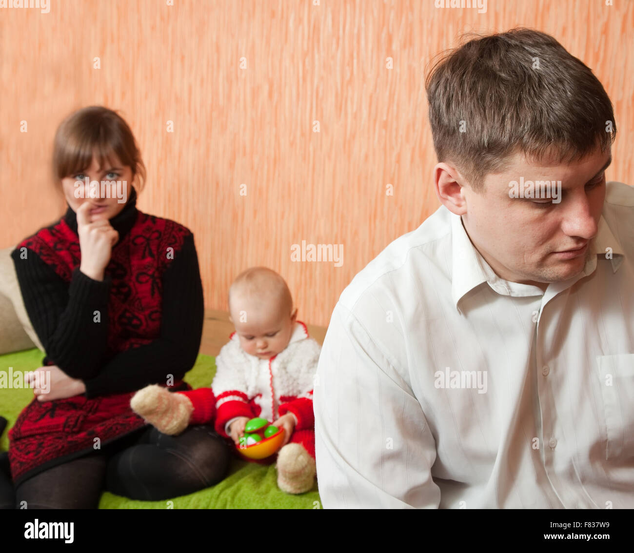 Family of three having quarrel at home Stock Photo - Alamy