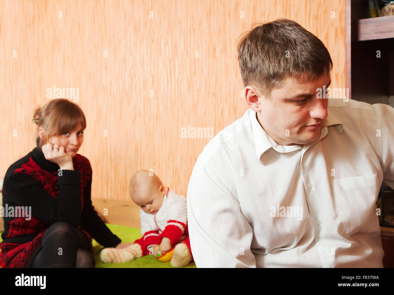 Family of three having quarrel at home Stock Photo - Alamy
