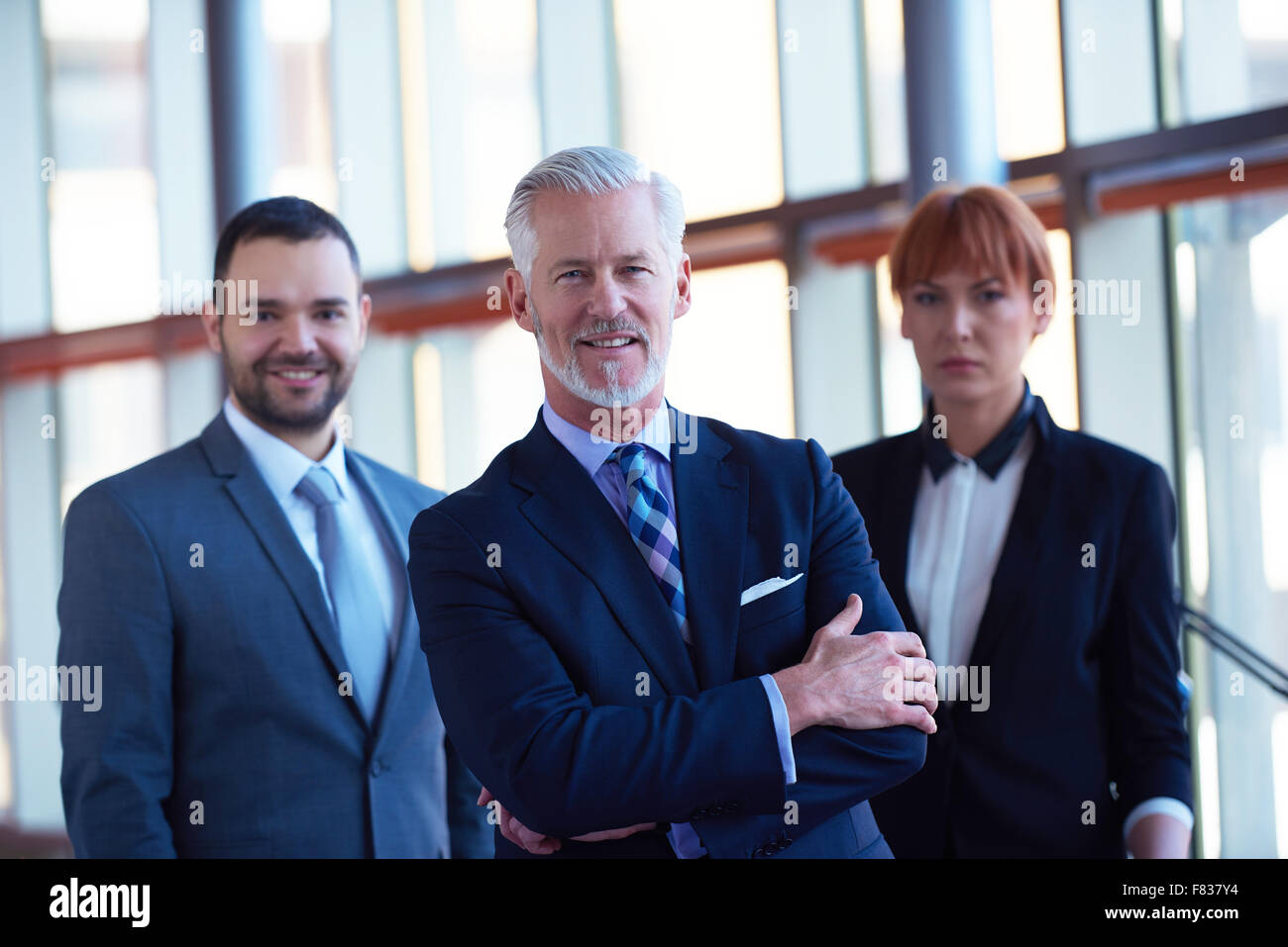 senior businessman with his team at office. business people group Stock ...