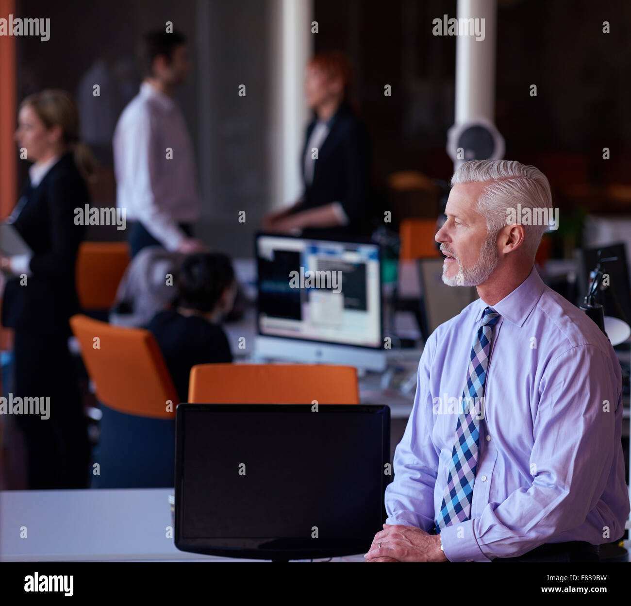 senior businessman with his team at office. business people group Stock ...