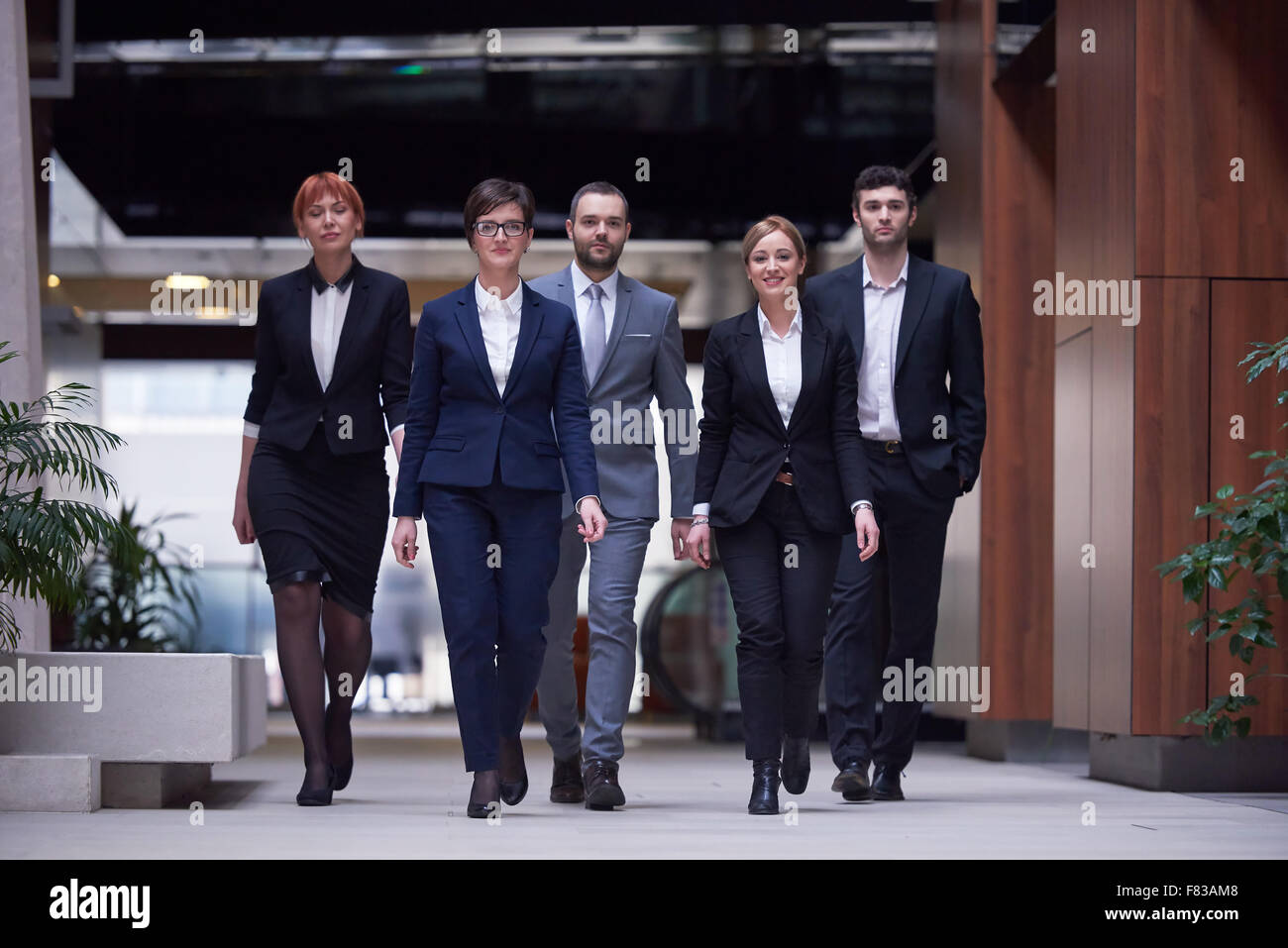 young business people team walking, group of people on modern office ...
