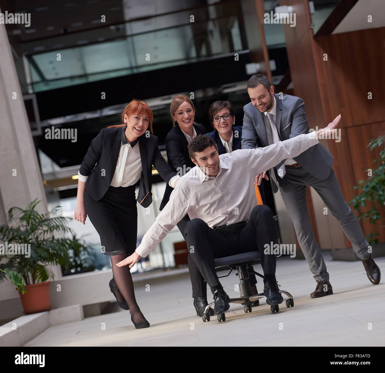 business people group at modern office indoors have fun and push office ...