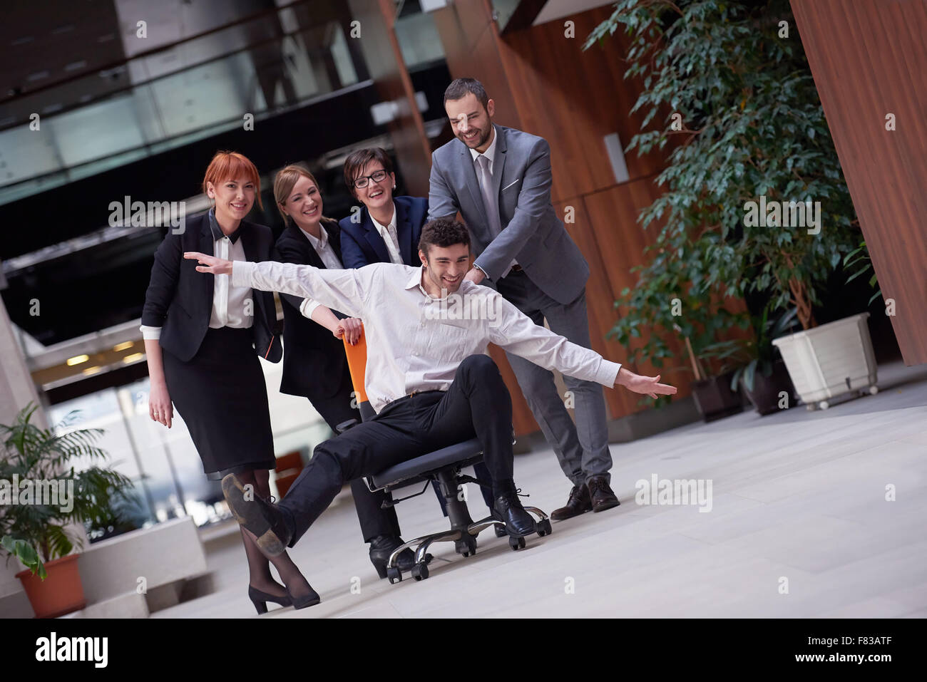 business people group at modern office indoors have fun and push office ...