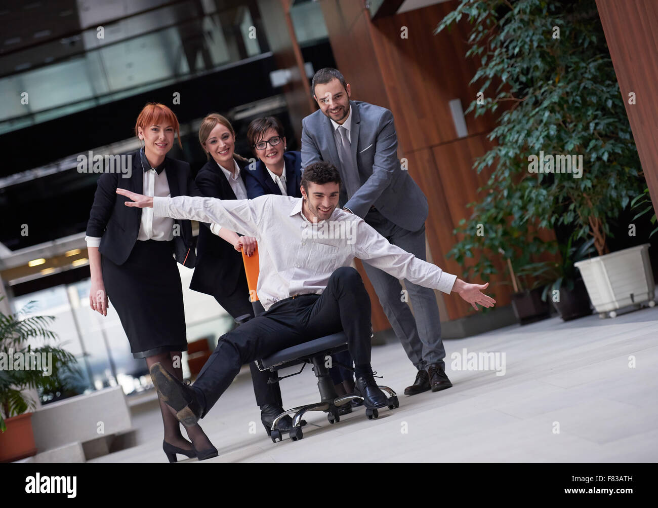 business people group at modern office indoors have fun and push office ...