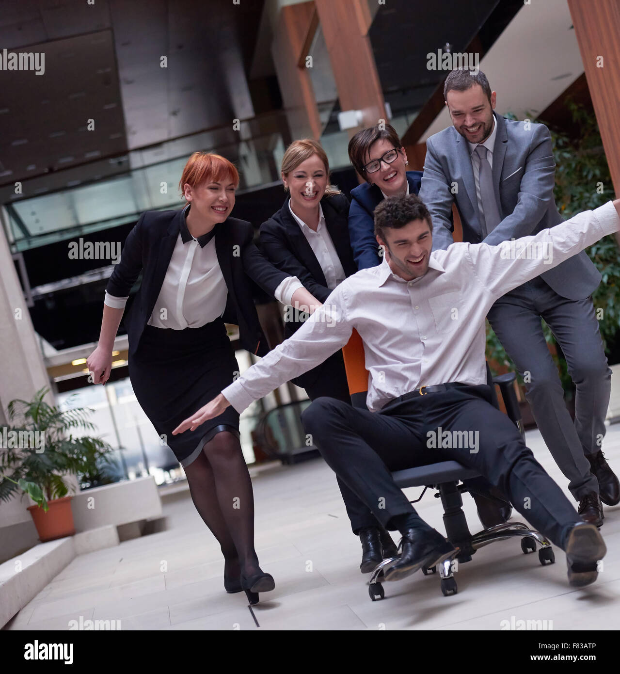business people group at modern office indoors have fun and push office ...