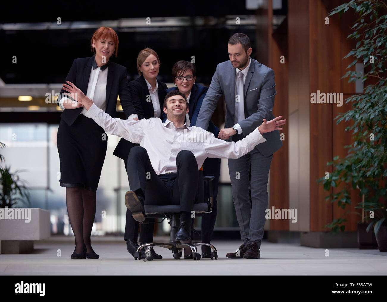 business people group at modern office indoors have fun and push office ...