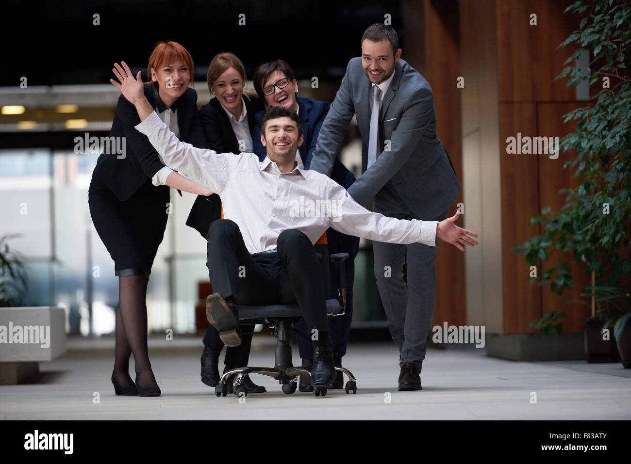 business people group at modern office indoors have fun and push office ...