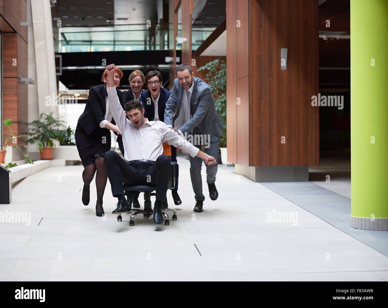 business people group at modern office indoors have fun and push office ...