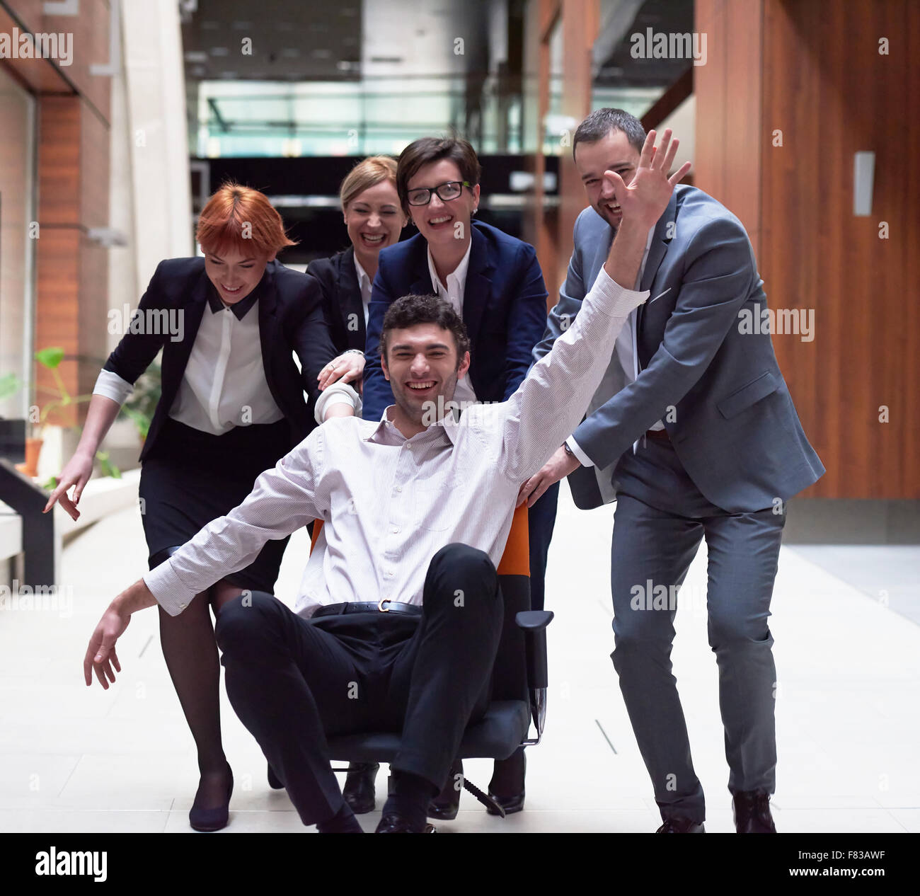 business people group at modern office indoors have fun and push office ...