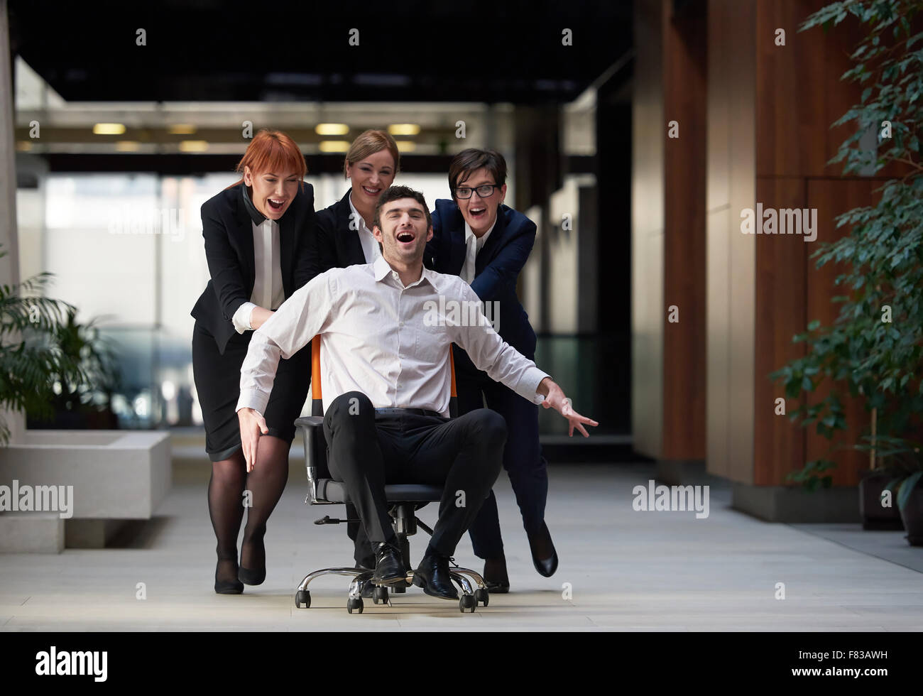 business people group at modern office indoors have fun and push office ...