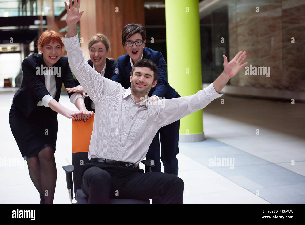 business people group at modern office indoors have fun and push office ...