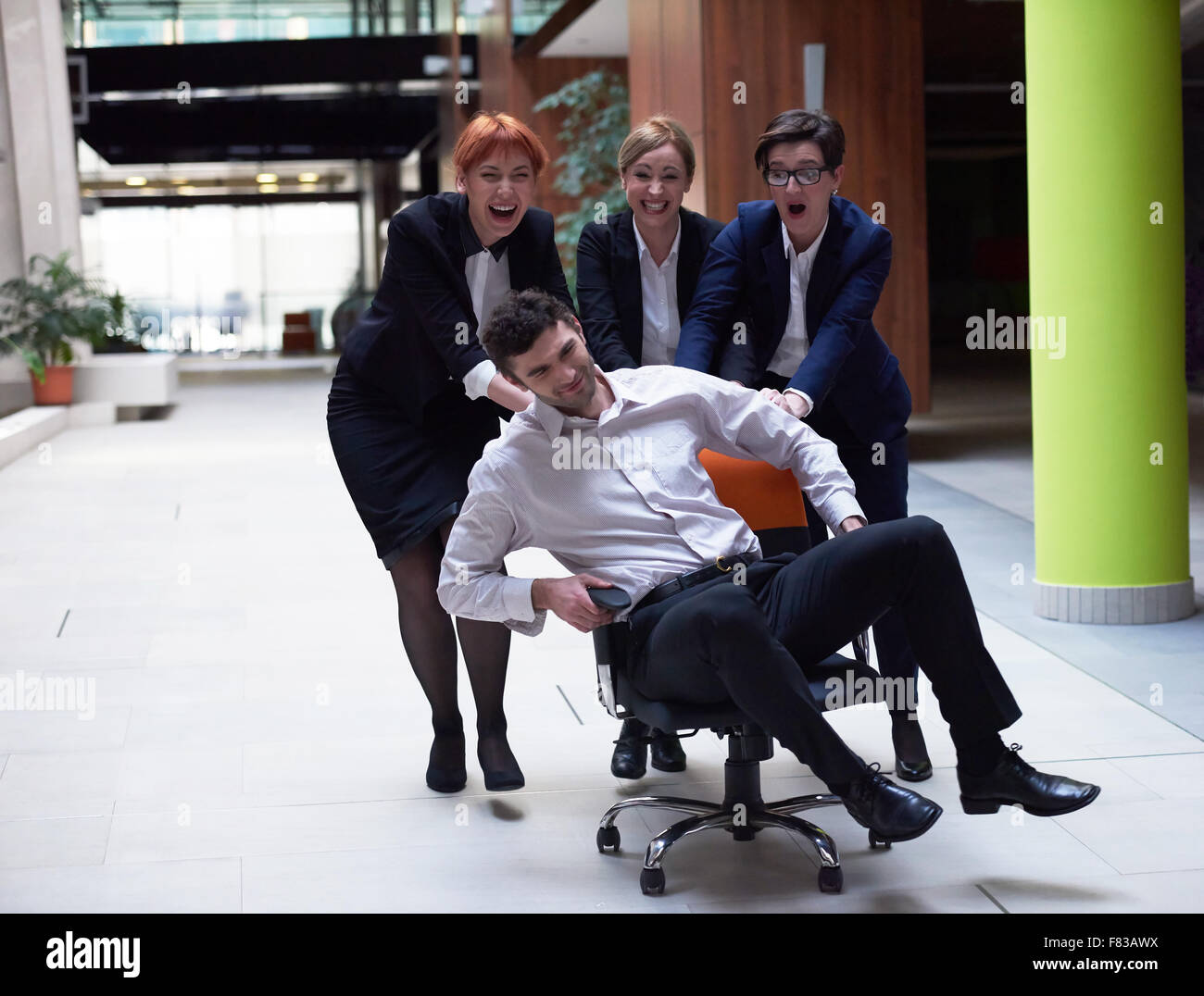 business people group at modern office indoors have fun and push office ...