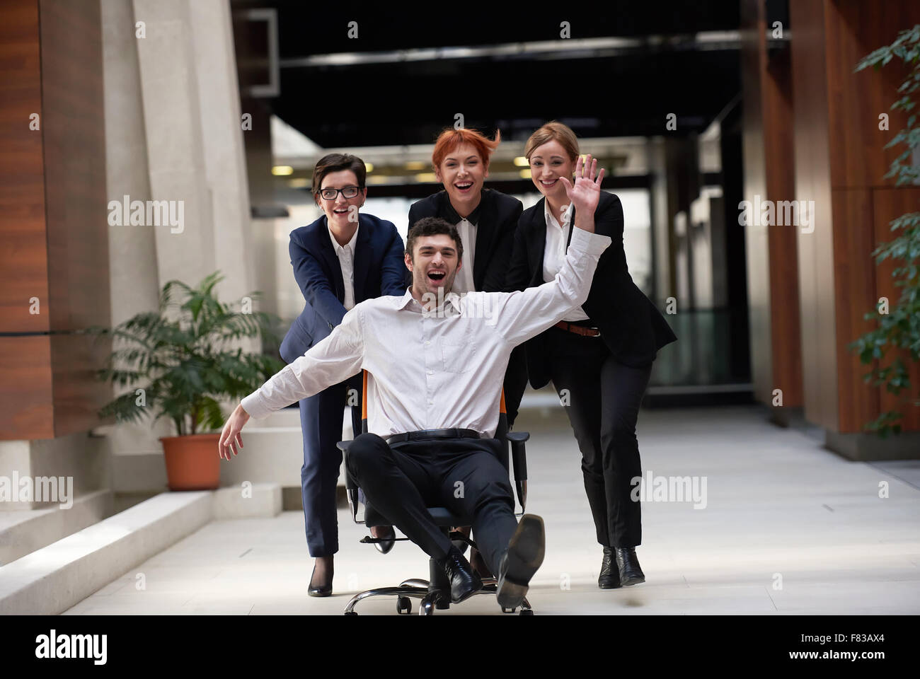 business people group at modern office indoors have fun and push office ...