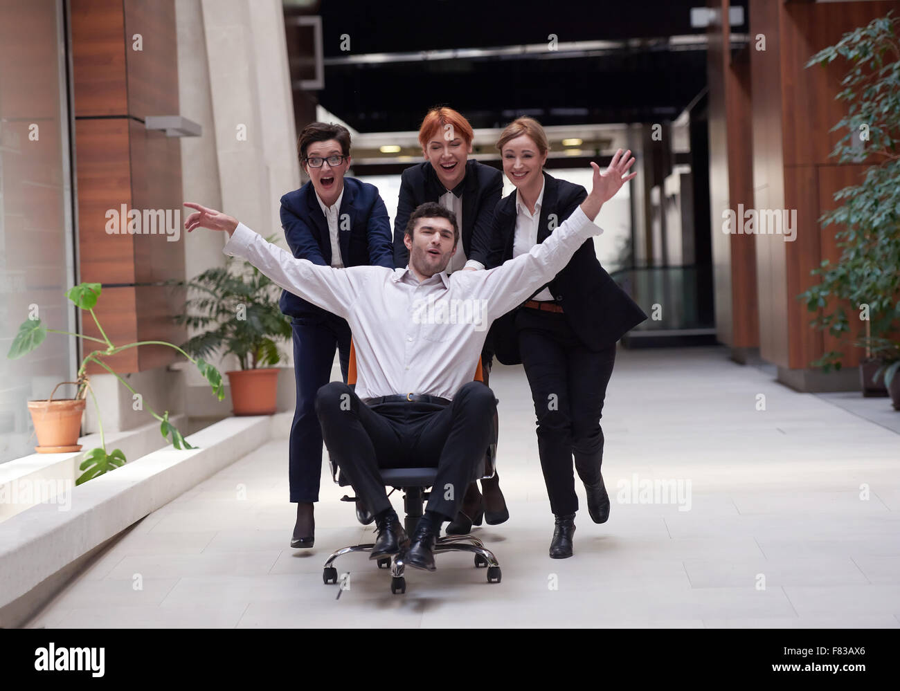 business people group at modern office indoors have fun and push office ...