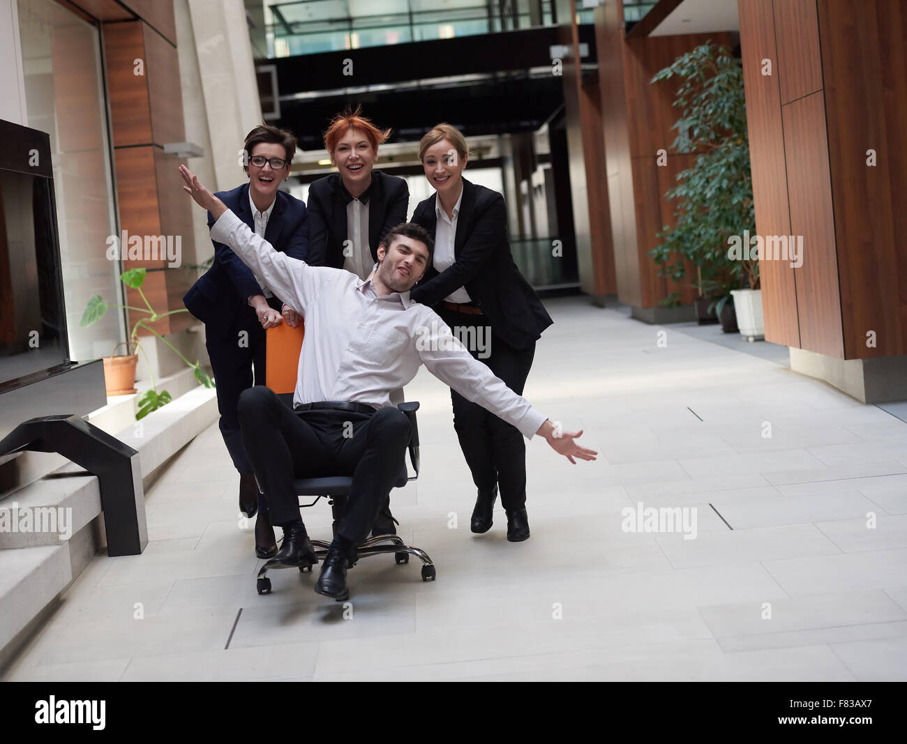 business people group at modern office indoors have fun and push office ...