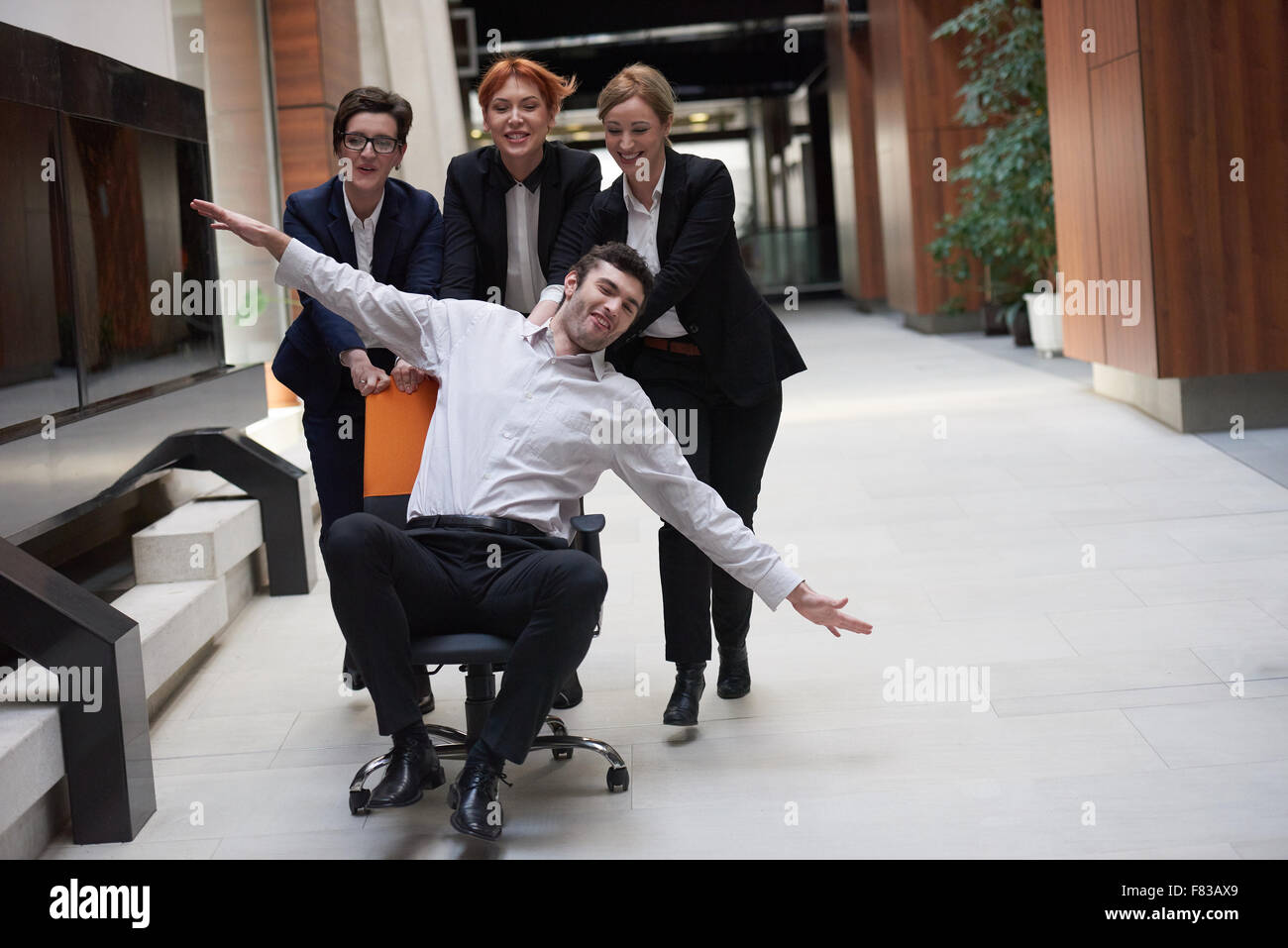 business people group at modern office indoors have fun and push office ...