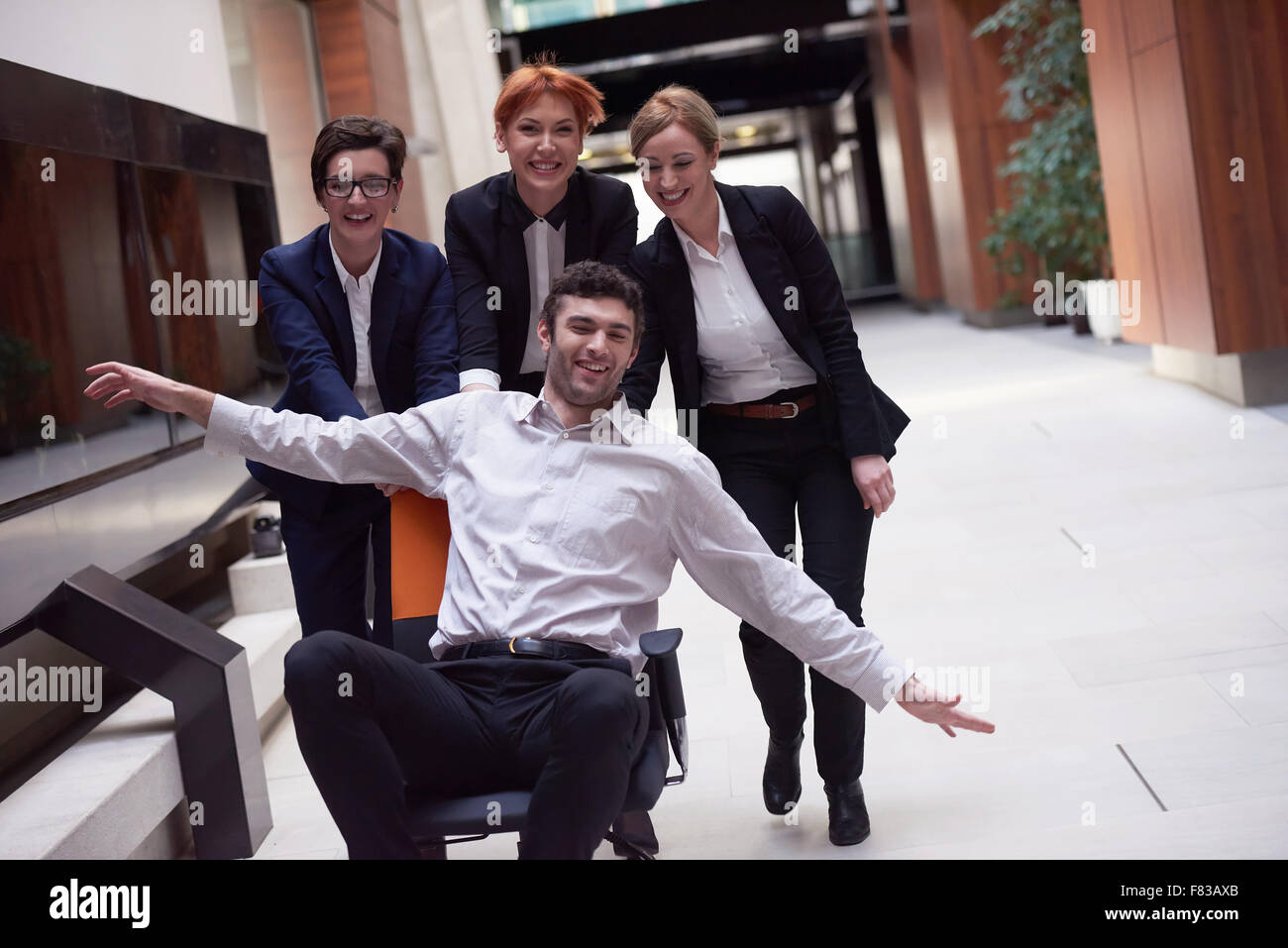 business people group at modern office indoors have fun and push office ...