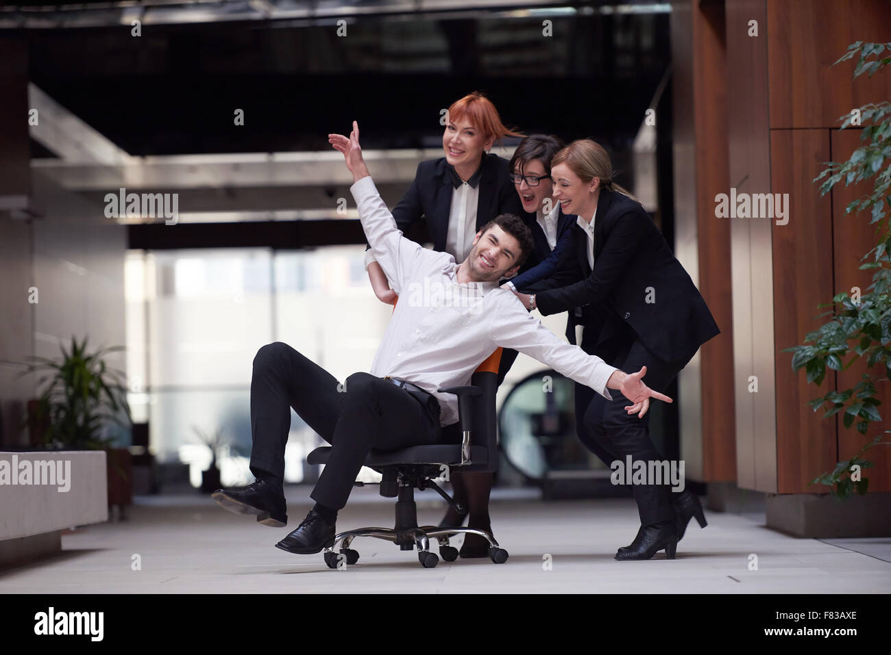 business people group at modern office indoors have fun and push office ...