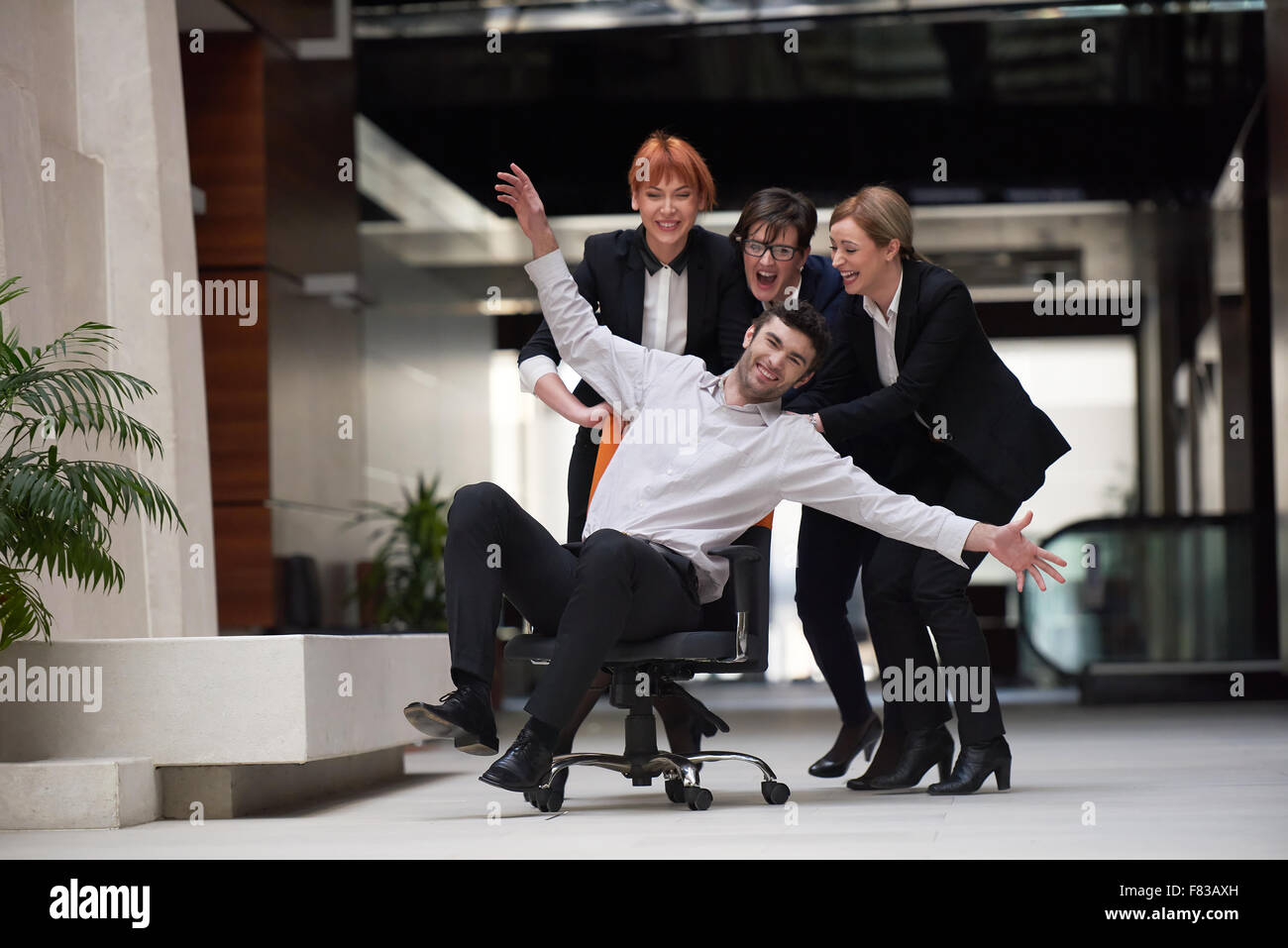business people group at modern office indoors have fun and push office ...