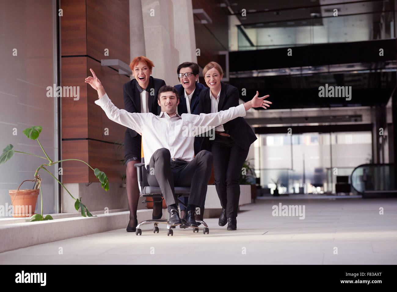 business people group at modern office indoors have fun and push office ...