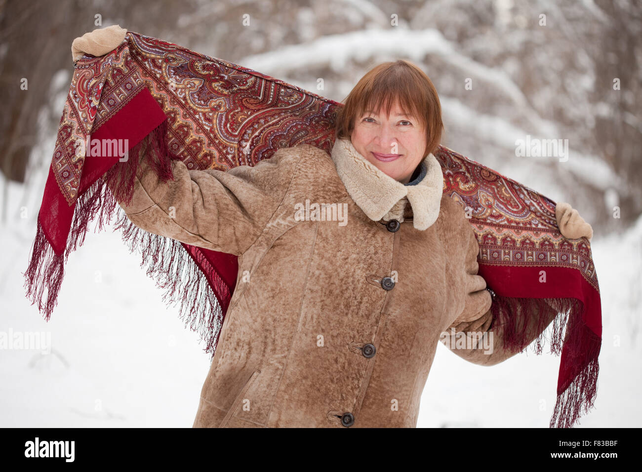 Happy mature woman with babushka in winter Stock Photo - Alamy