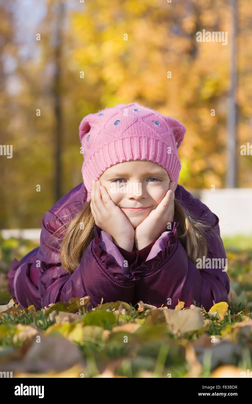 Portrait of little girl against autumn nature Stock Photo - Alamy