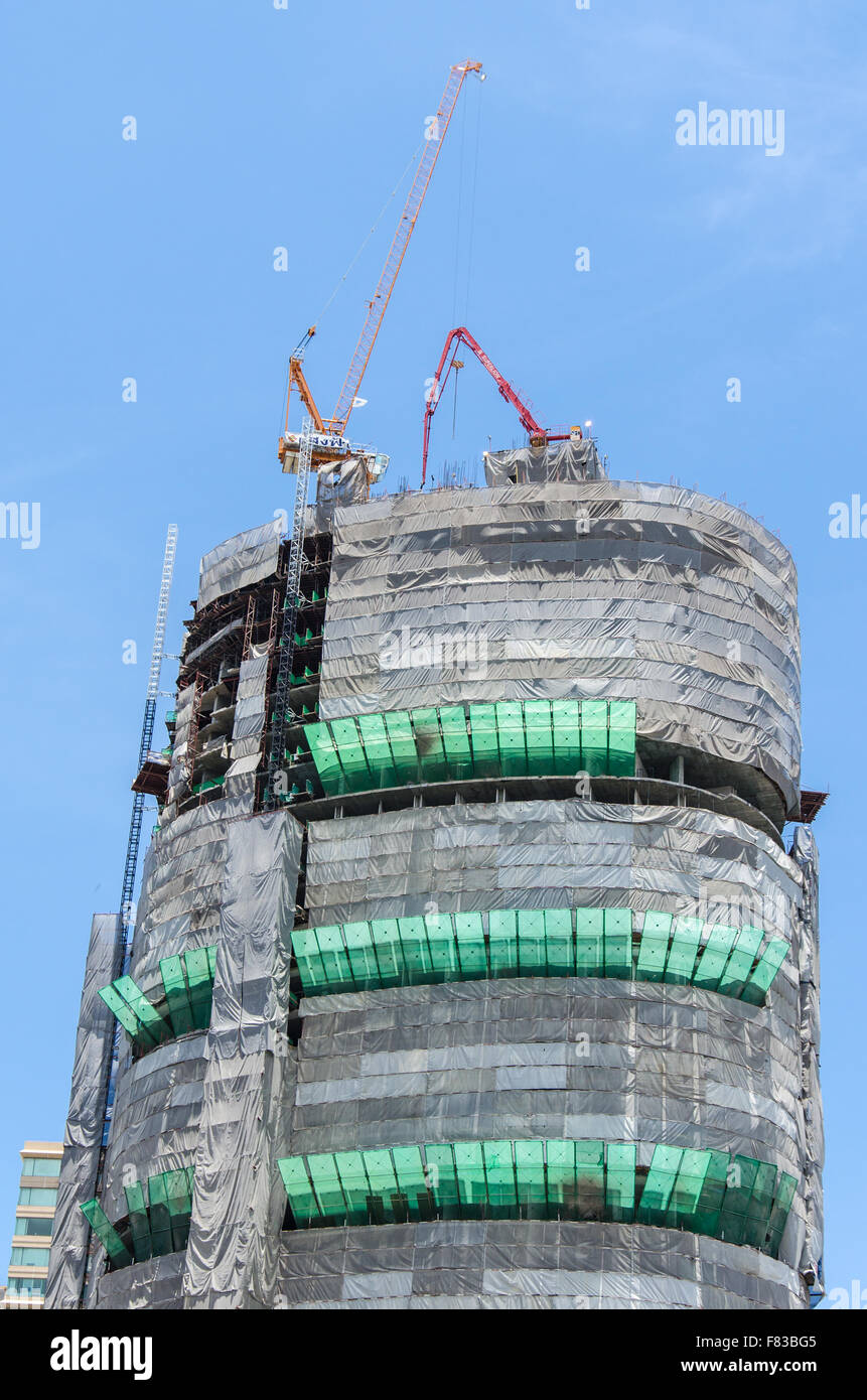High-rise building construction using tower cranes and other ...
