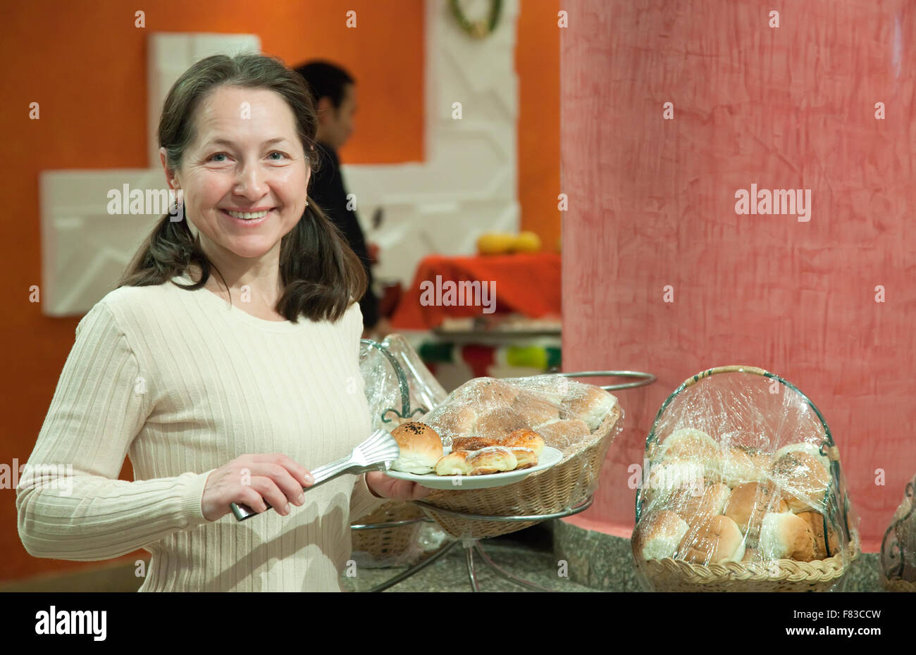 woman takes fresh batch on the table in the cafeteria Stock Photo - Alamy