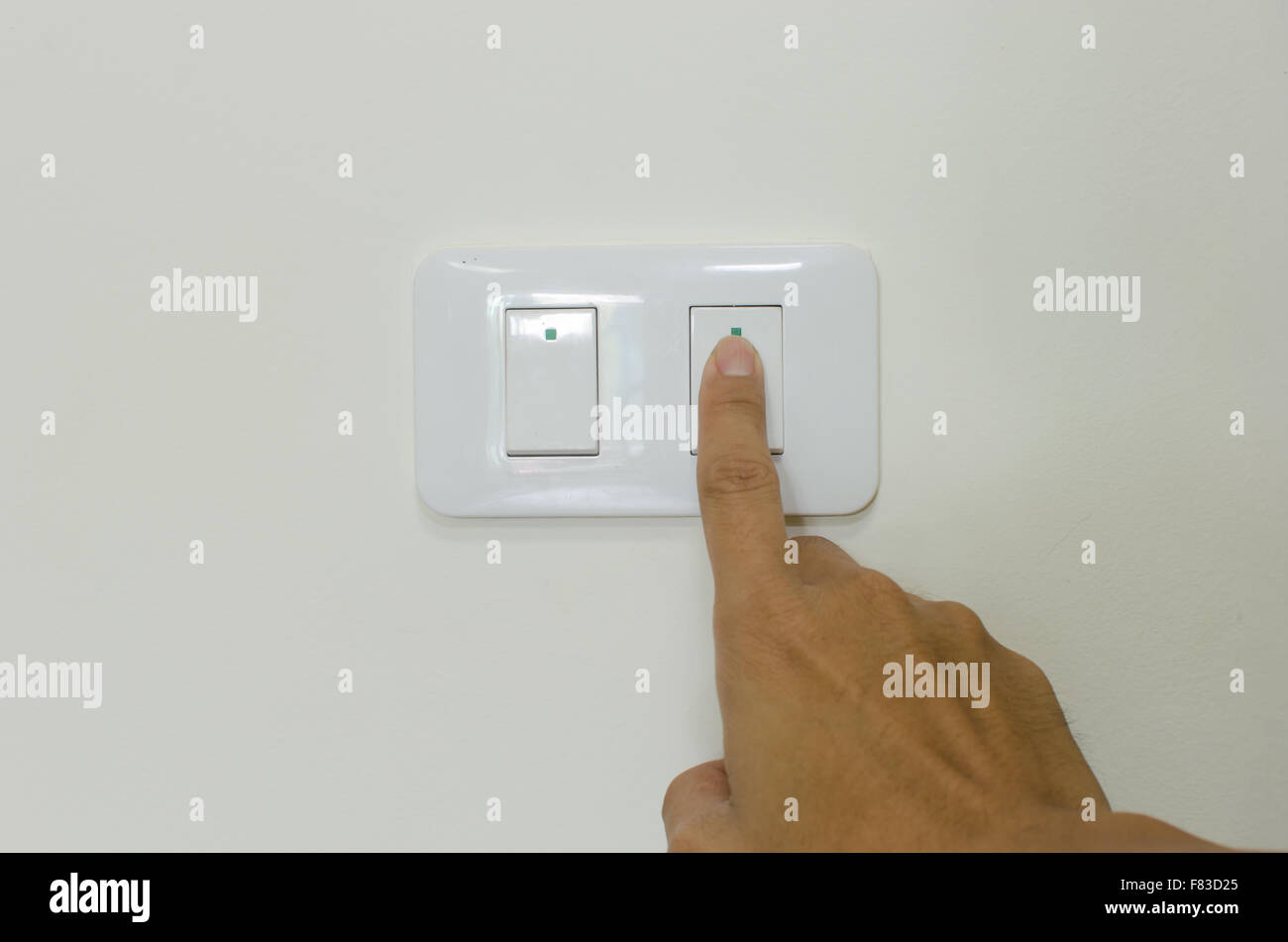 hand pressing electronic-light switch Stock Photo - Alamy