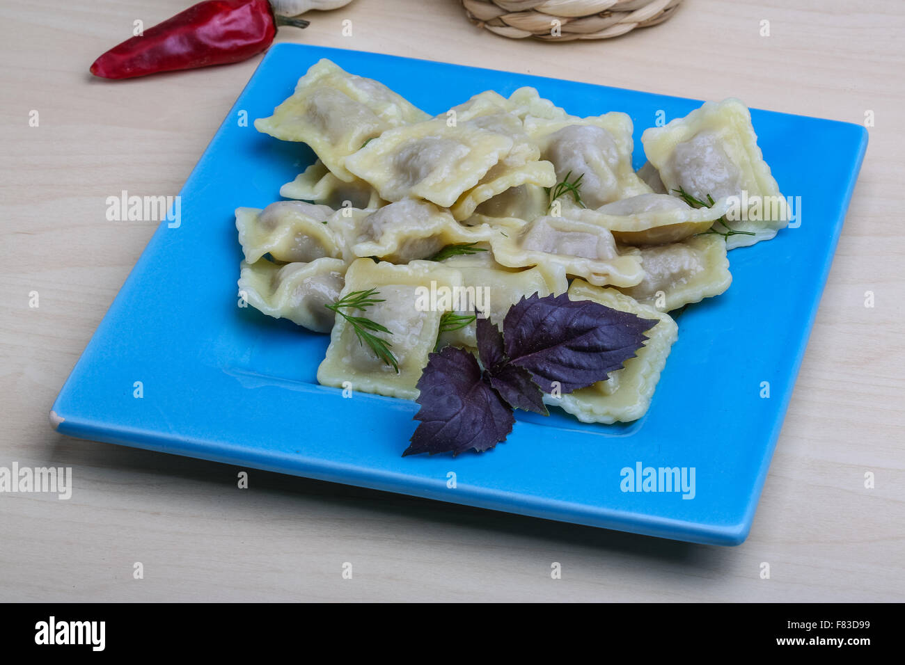 Italian dumplings Ravioli with fresh herbs and spices Stock Photo - Alamy