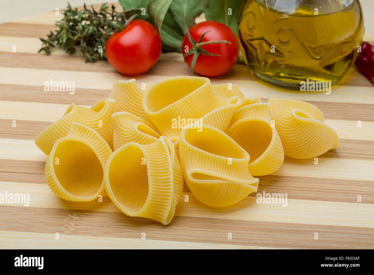 Pipe rigate pasta on the wood background Stock Photo - Alamy