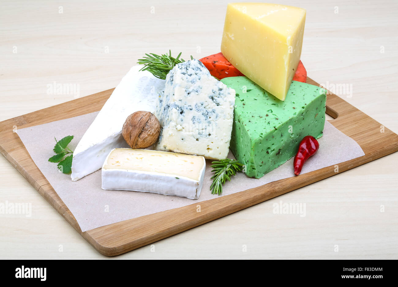 Assortment cheese with herbs on the wood background Stock Photo - Alamy