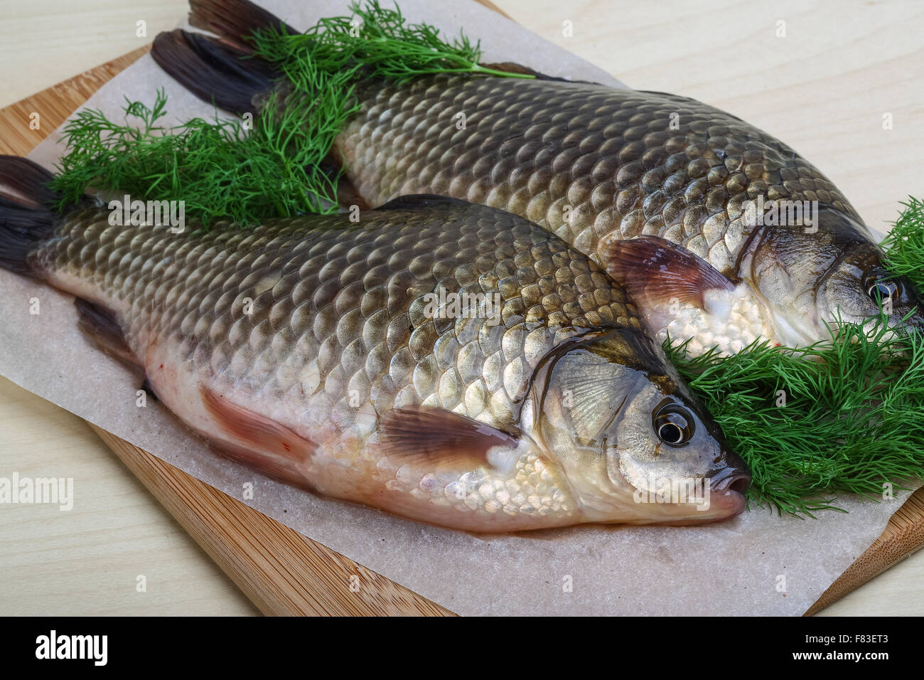 Two crucian with dill ready for cooking Stock Photo - Alamy
