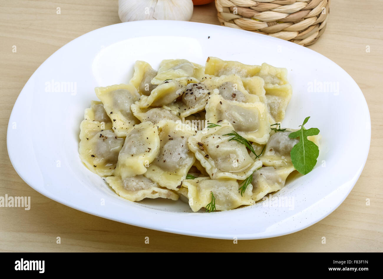 Italian dumplings Ravioli with fresh herbs and spices Stock Photo - Alamy