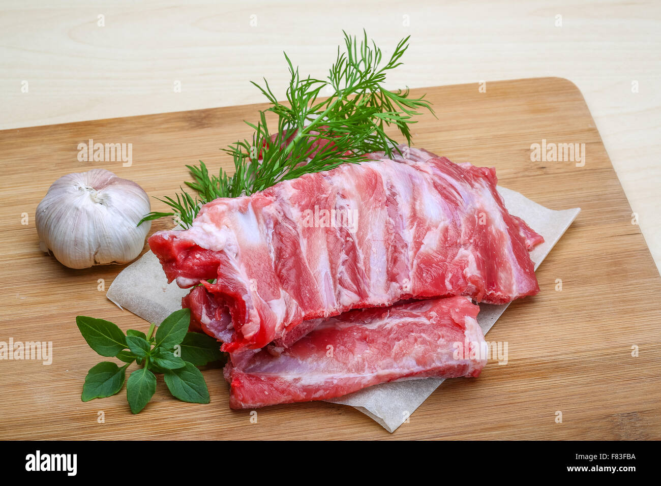 Raw pork ribs with dill - ready for cooking Stock Photo - Alamy