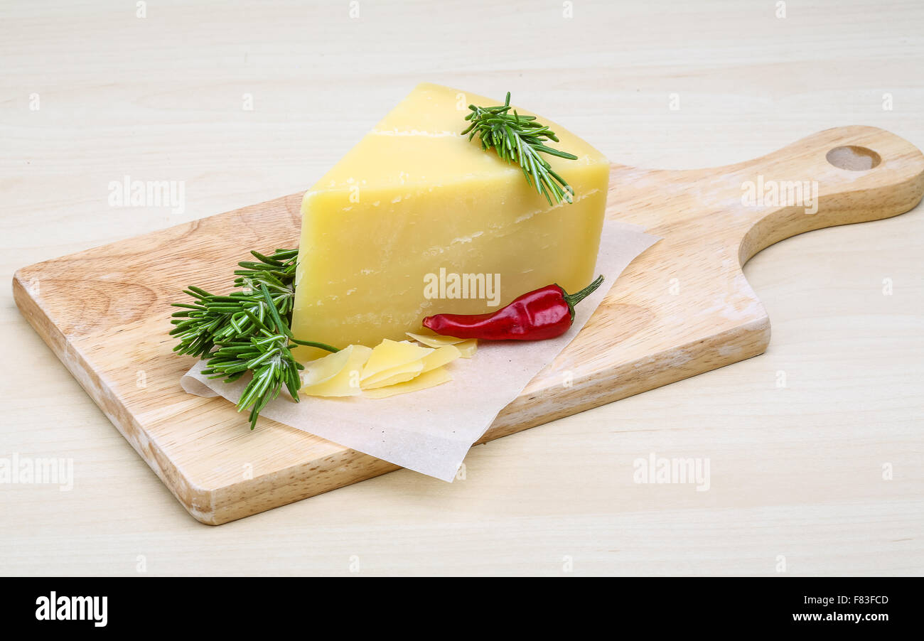 Parmesan cheese with rosemary on the wood background Stock Photo - Alamy