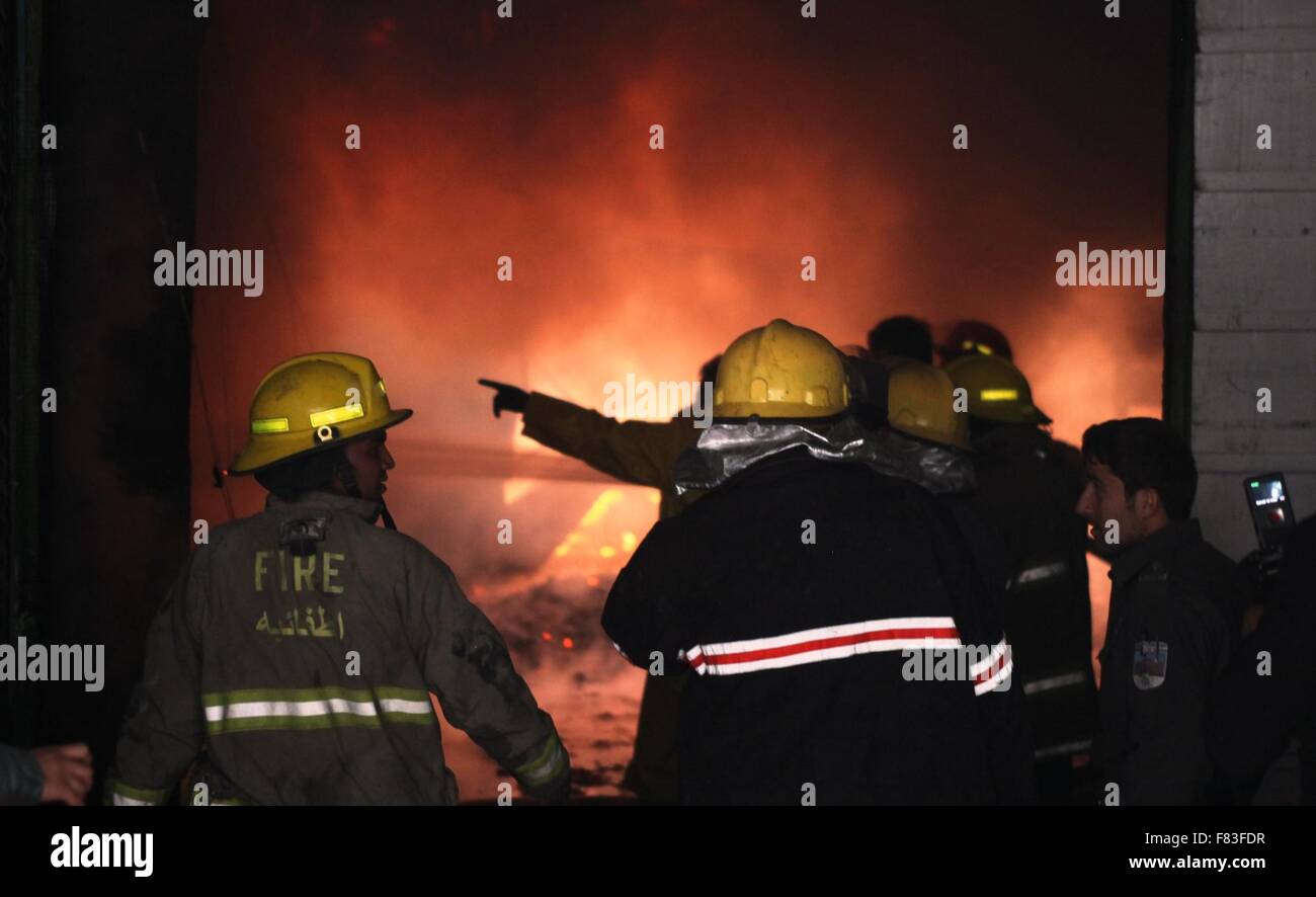 Kabul, Afghanistan. 5th Dec, 2015. Firefighters try to extinguish a ...