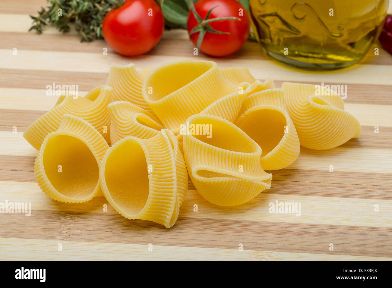 Pipe rigate pasta on the wood background Stock Photo - Alamy
