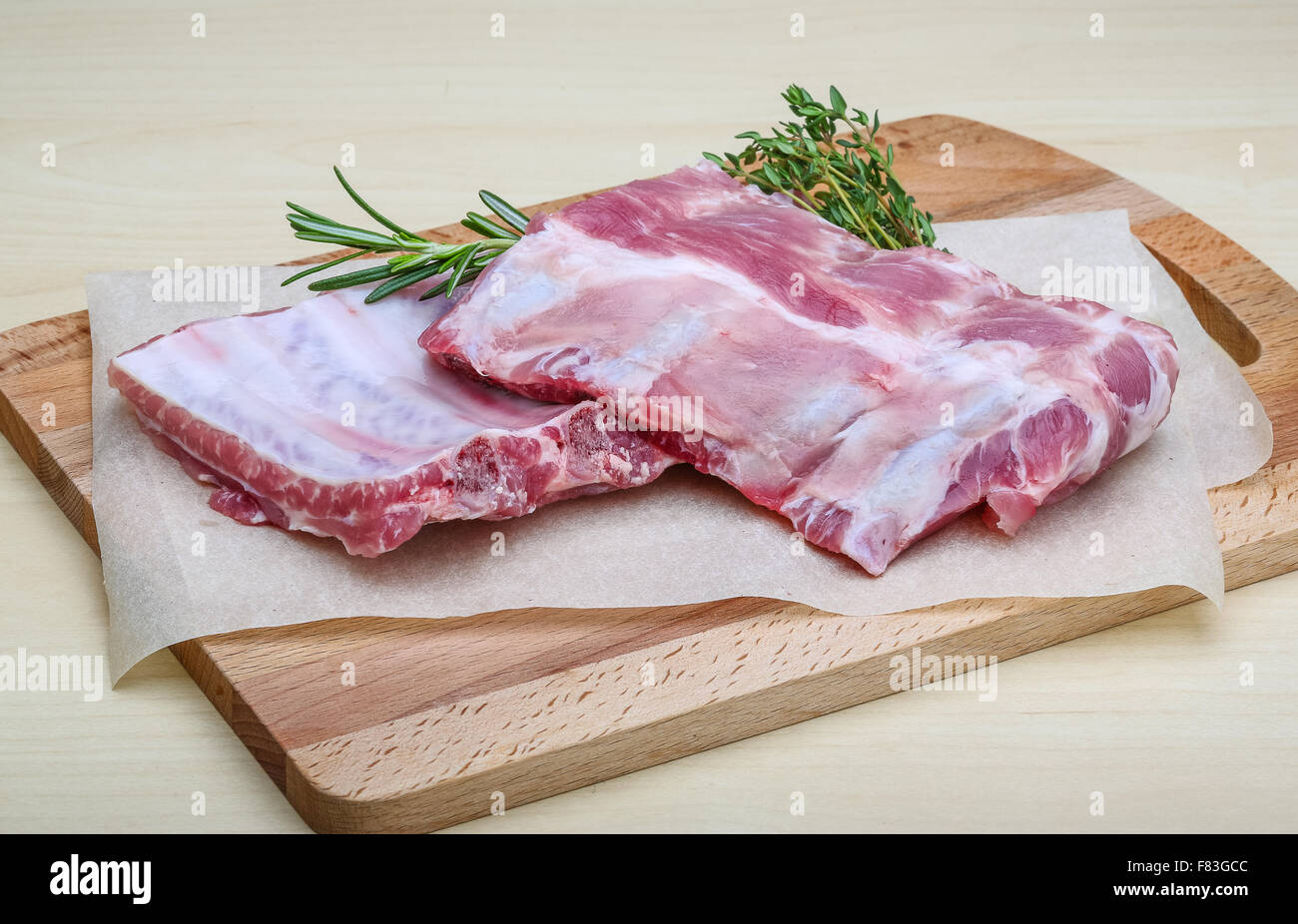 Raw pork ribs with rosemary and thyme Stock Photo - Alamy