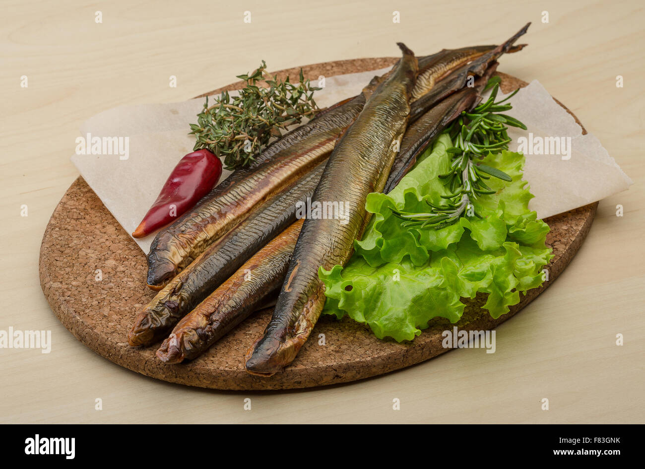 Smoked Lamprey - seafood delicacy with salad and herbs Stock Photo - Alamy