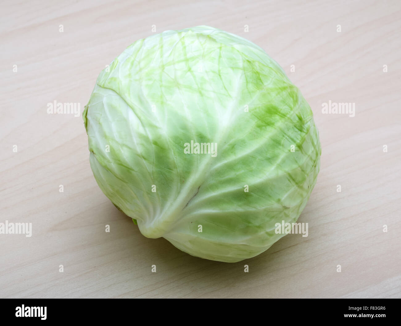 Fresh ripe cabbage on the wood background Stock Photo - Alamy