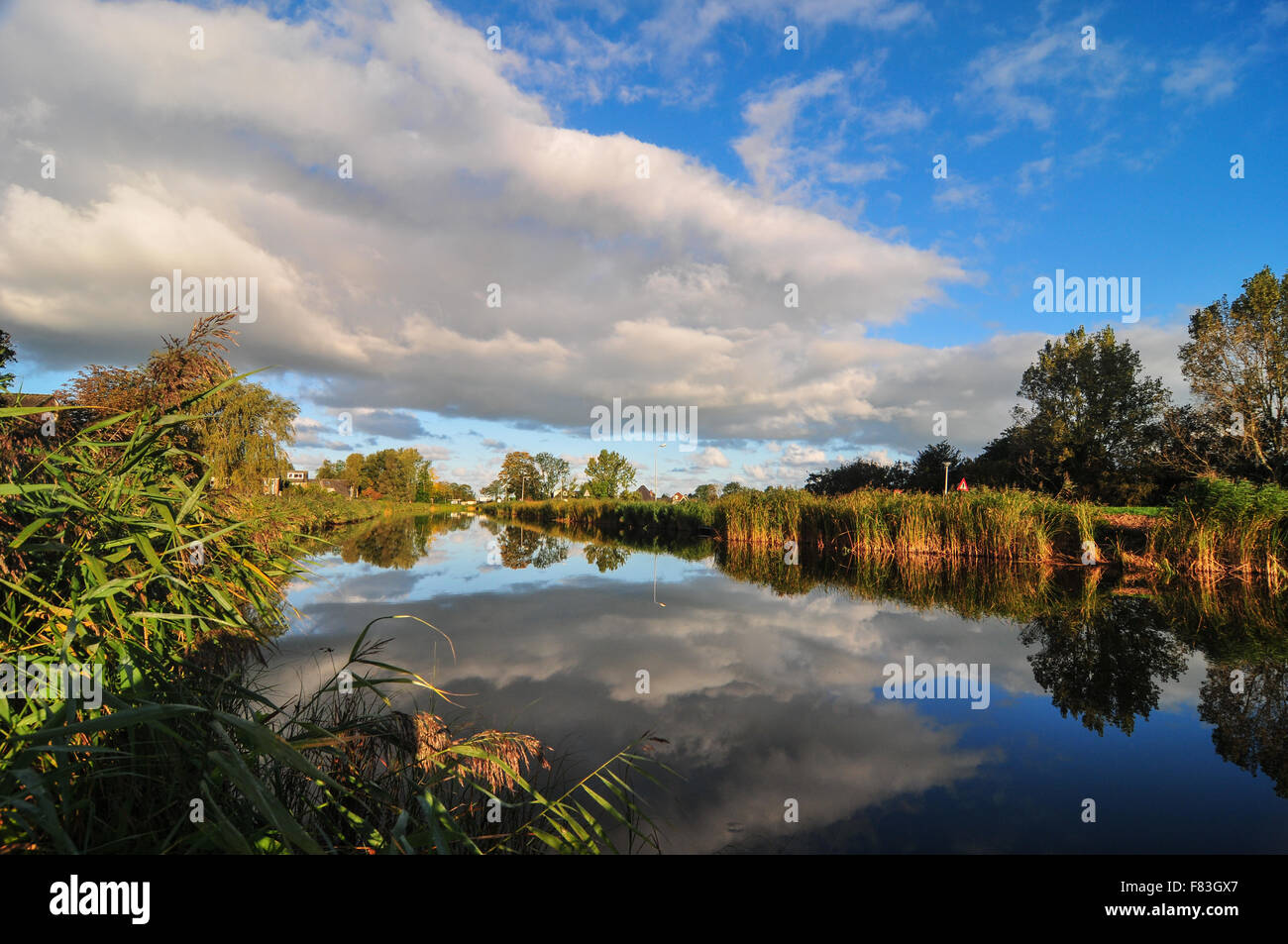 Beautiful dutch landscape an typical dutch sky and clouds Stock Photo ...
