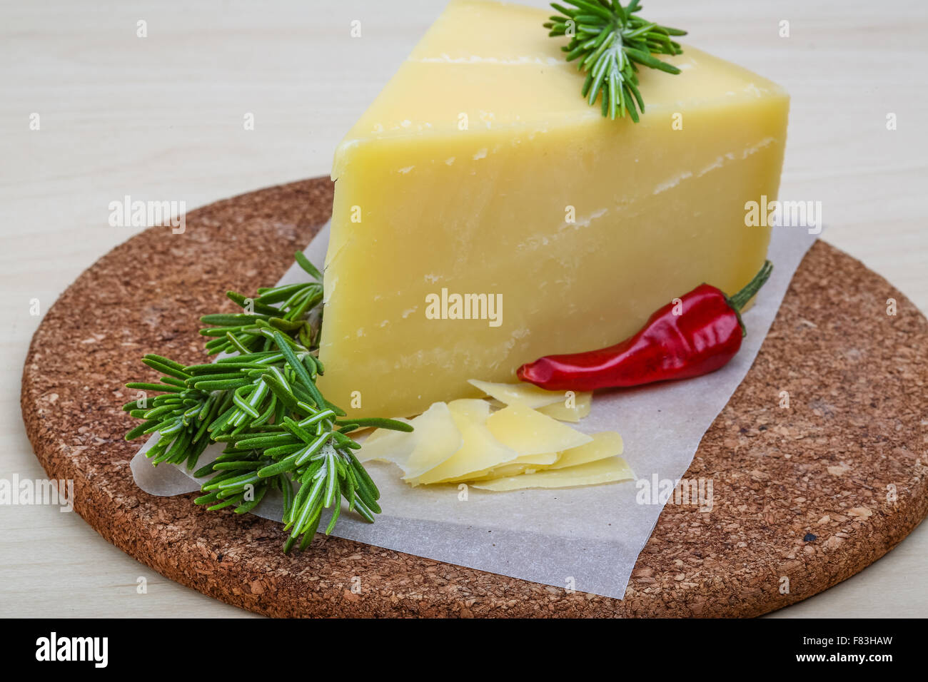 Parmesan cheese with rosemary on the wood background Stock Photo - Alamy